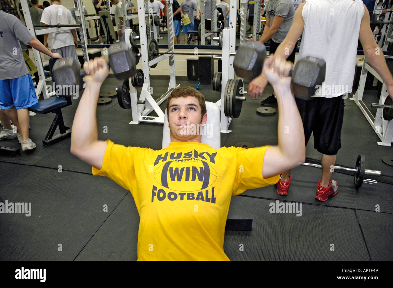 High school student lifts iron weights in a body building class Stock ...