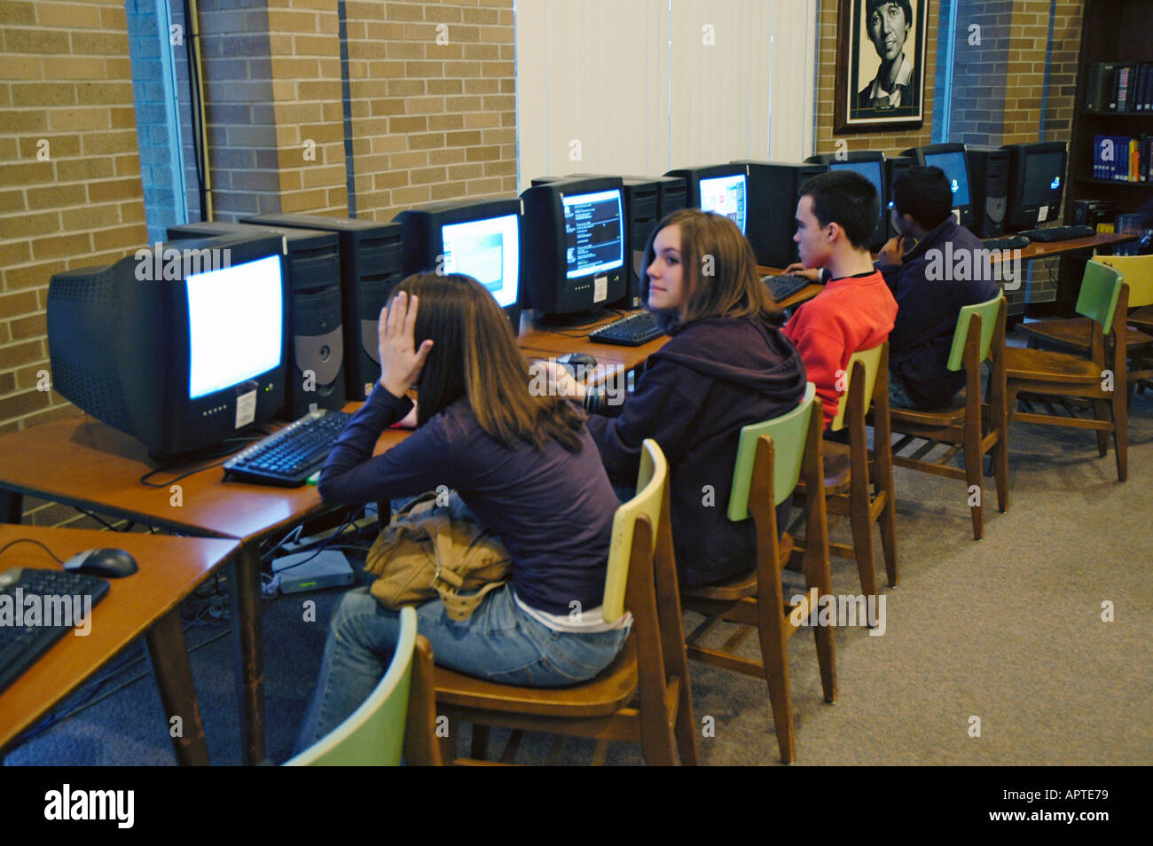 Students study with computers in a learning resource center located in ...