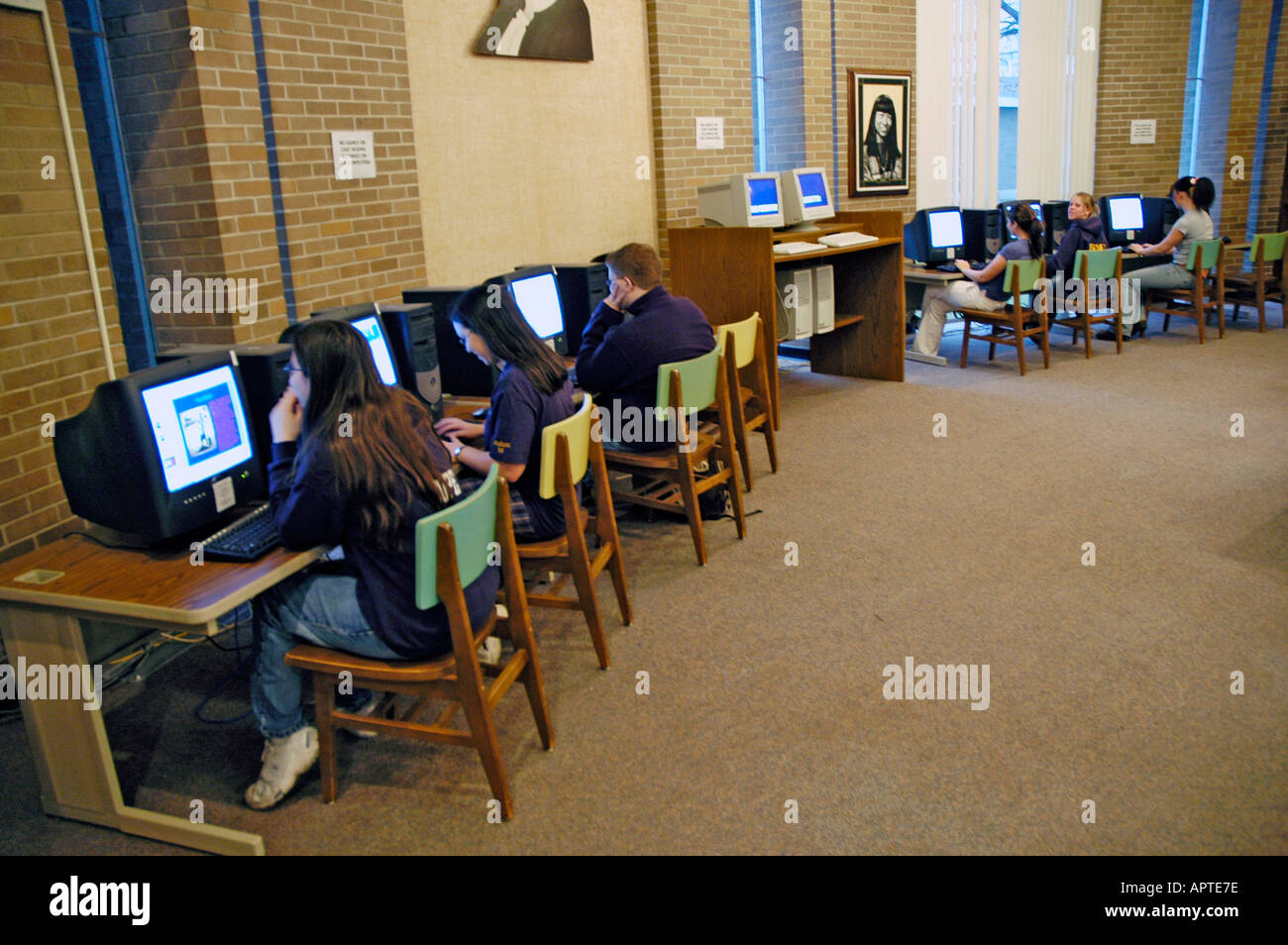 Students study with computers in a learning resource center located in ...