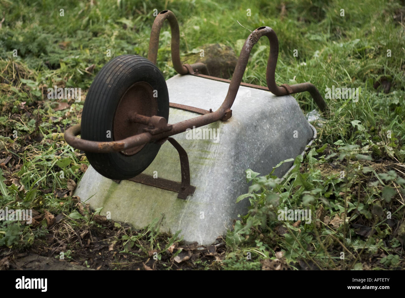 Old upturned wheelbarrow Stock Photo - Alamy