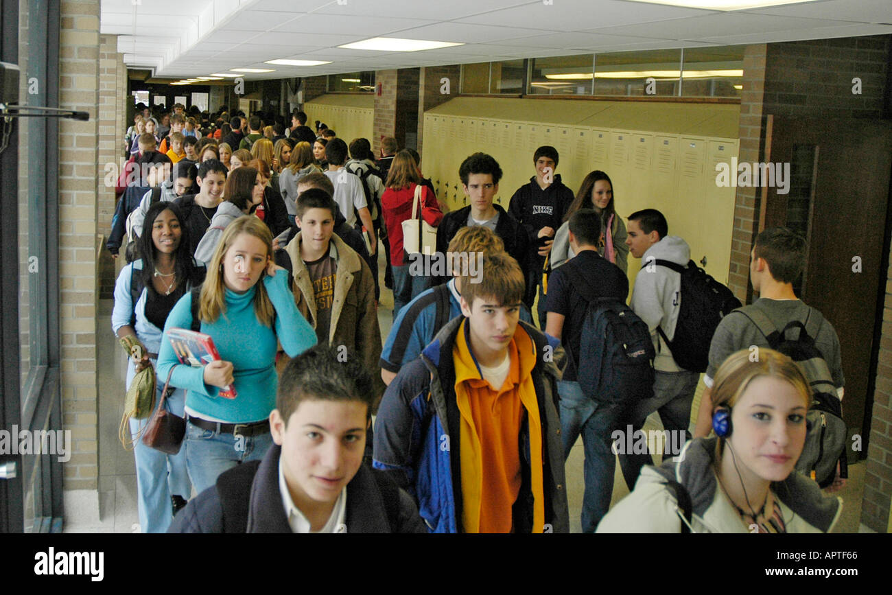 Crowds of high school students fill hallways during the exchanging of ...