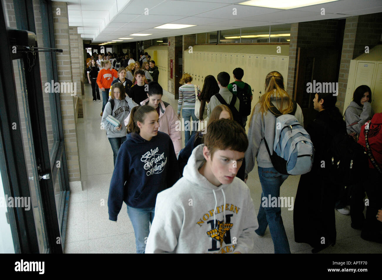 Crowds of high school students fill hallways during the exchanging of ...