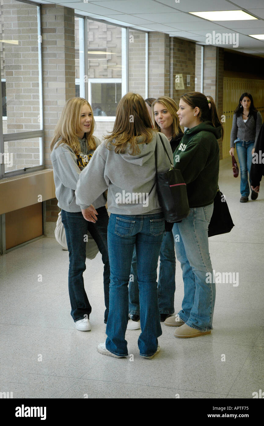 High school students meet in small group between classes to socialize ...