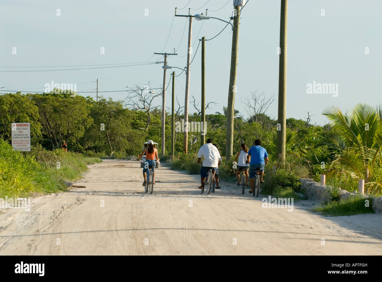 locals riding bicycle on dirt road in Belize Stock Photo - Alamy