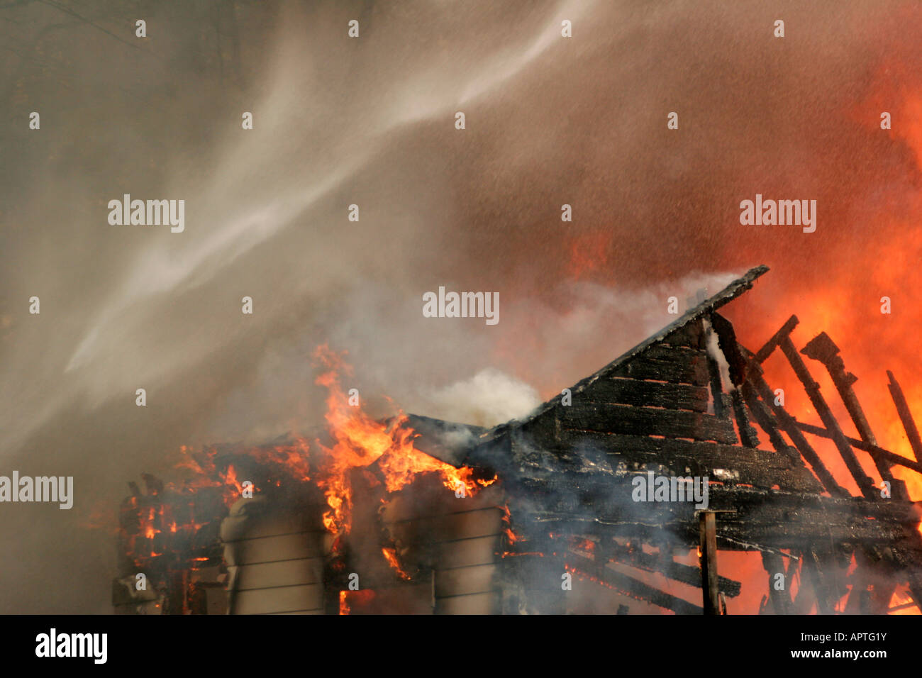 A house structure fire being attacked with water spray from the Fire ...