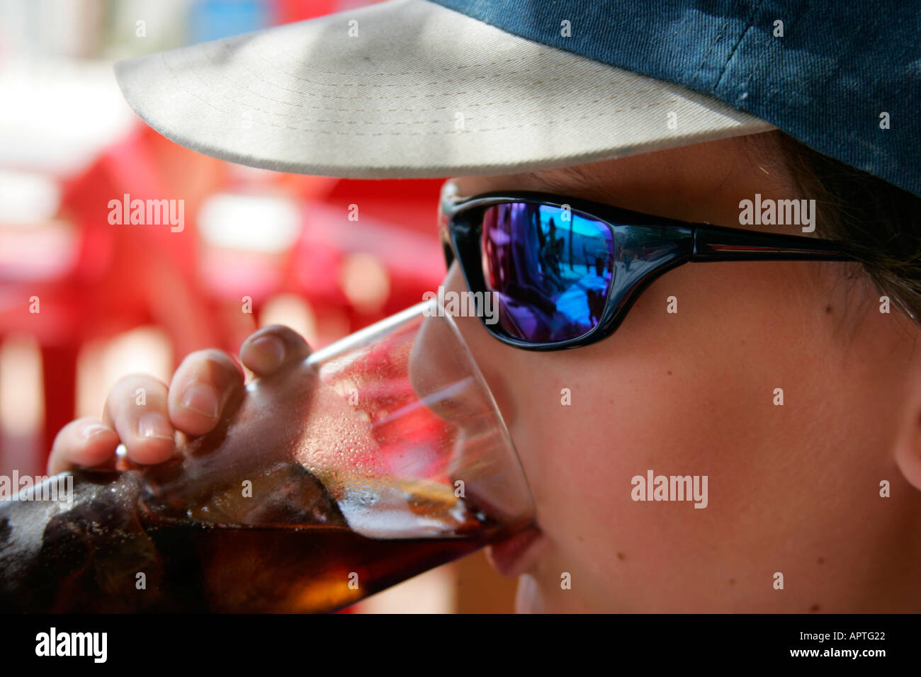 BOY WITH SUNGLASSES DRINKING COKE Stock Photo - Alamy