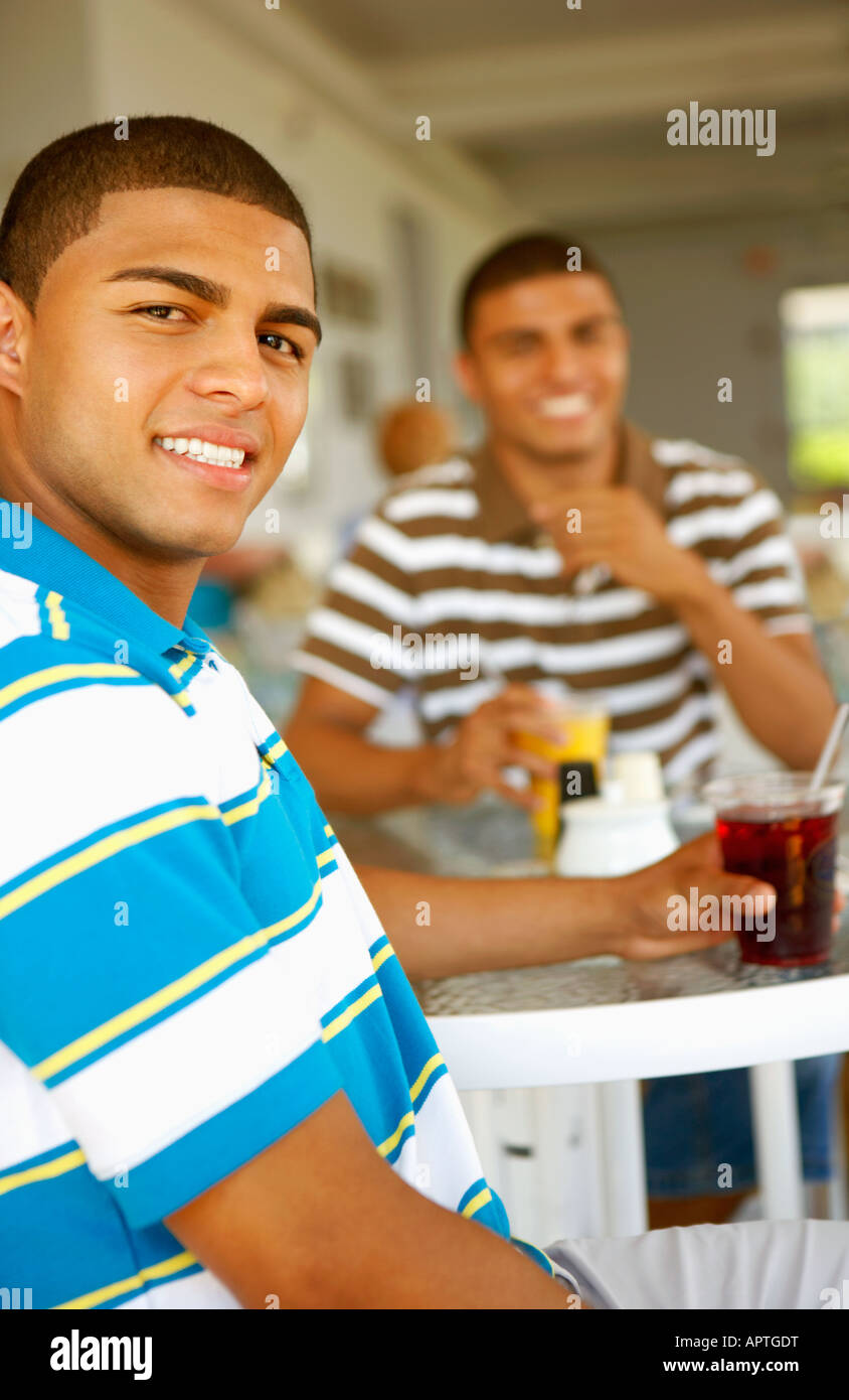 Hispanic men drinking at bar Stock Photo - Alamy