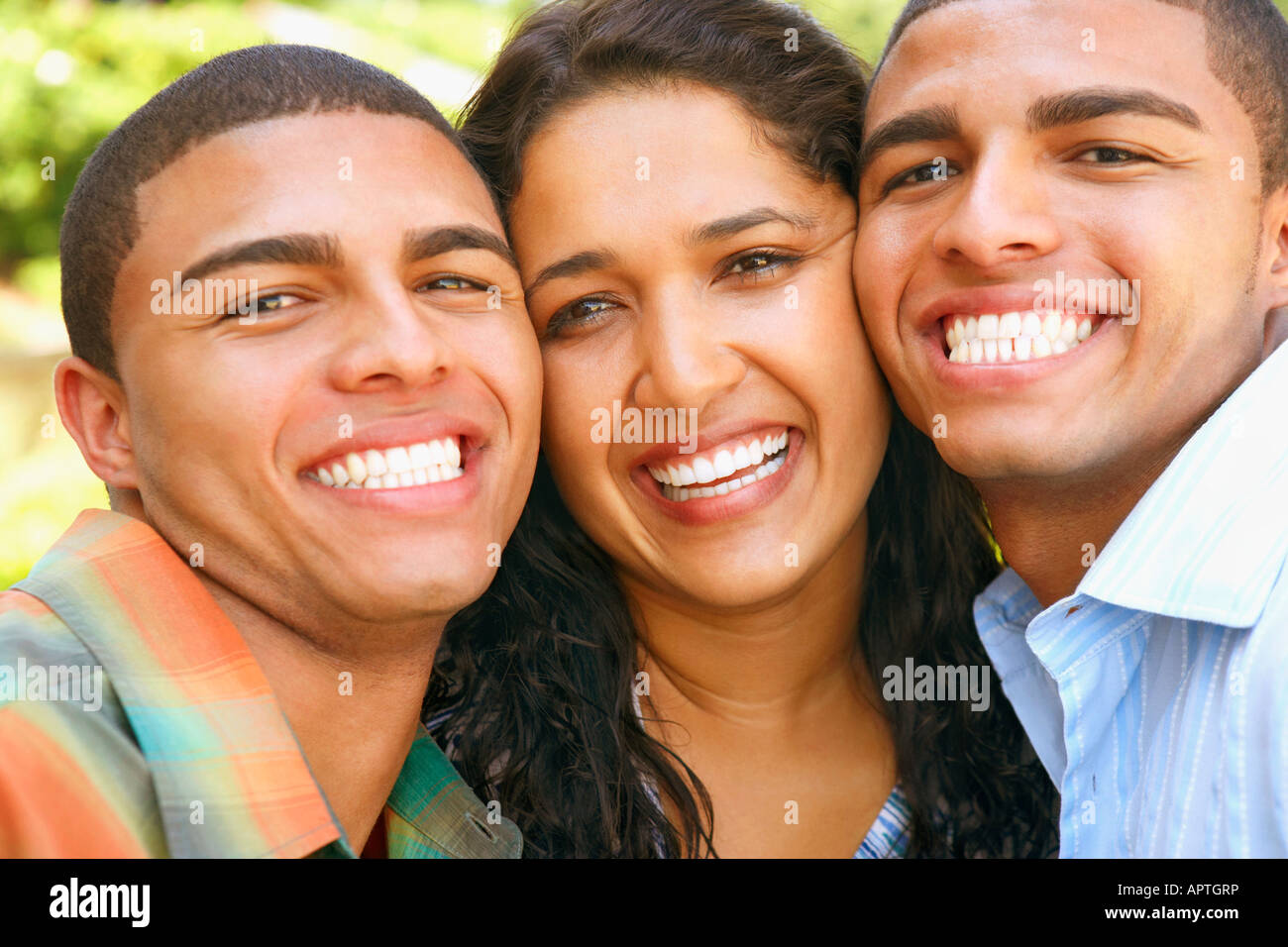 Hispanic siblings hugging Stock Photo - Alamy