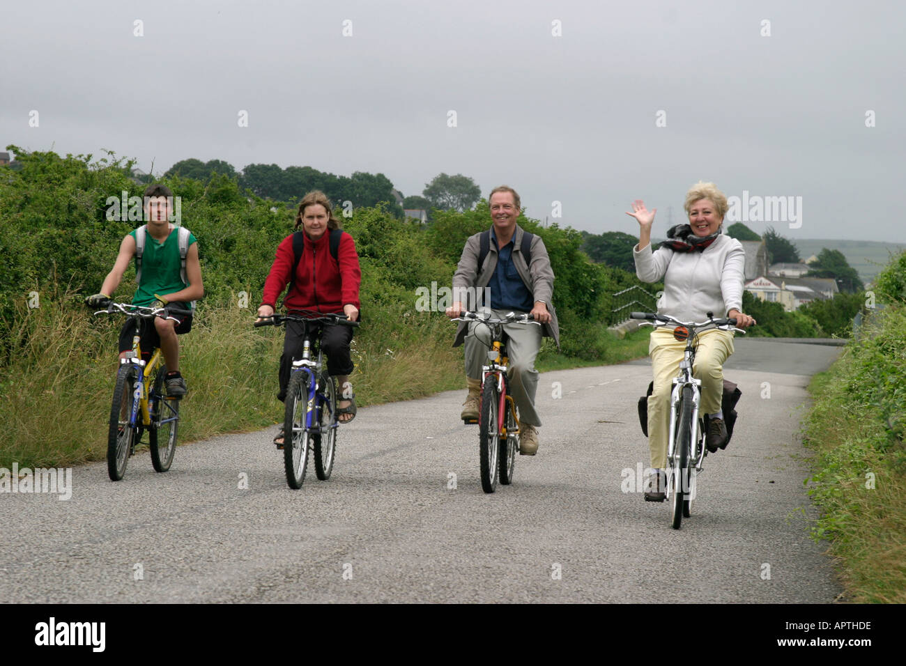 Family group cycling on the Camel Trail Wadebridge Cornwall National ...