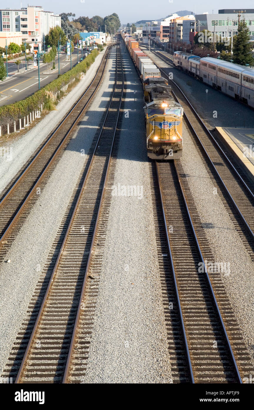 Freight Train On Railroad With Cargo Stock Photo - Alamy