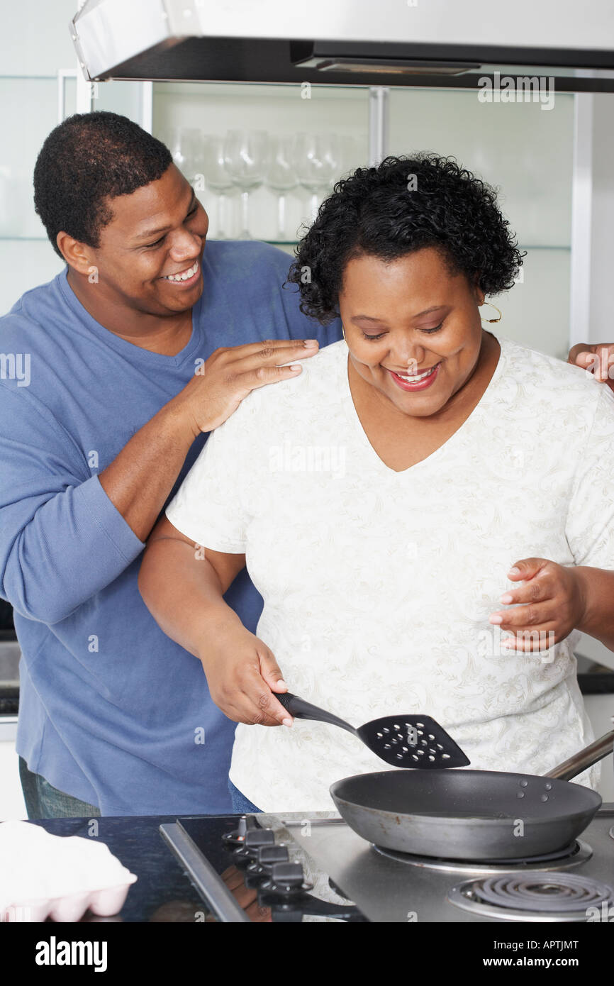 African couple cooking in kitchen Stock Photo - Alamy