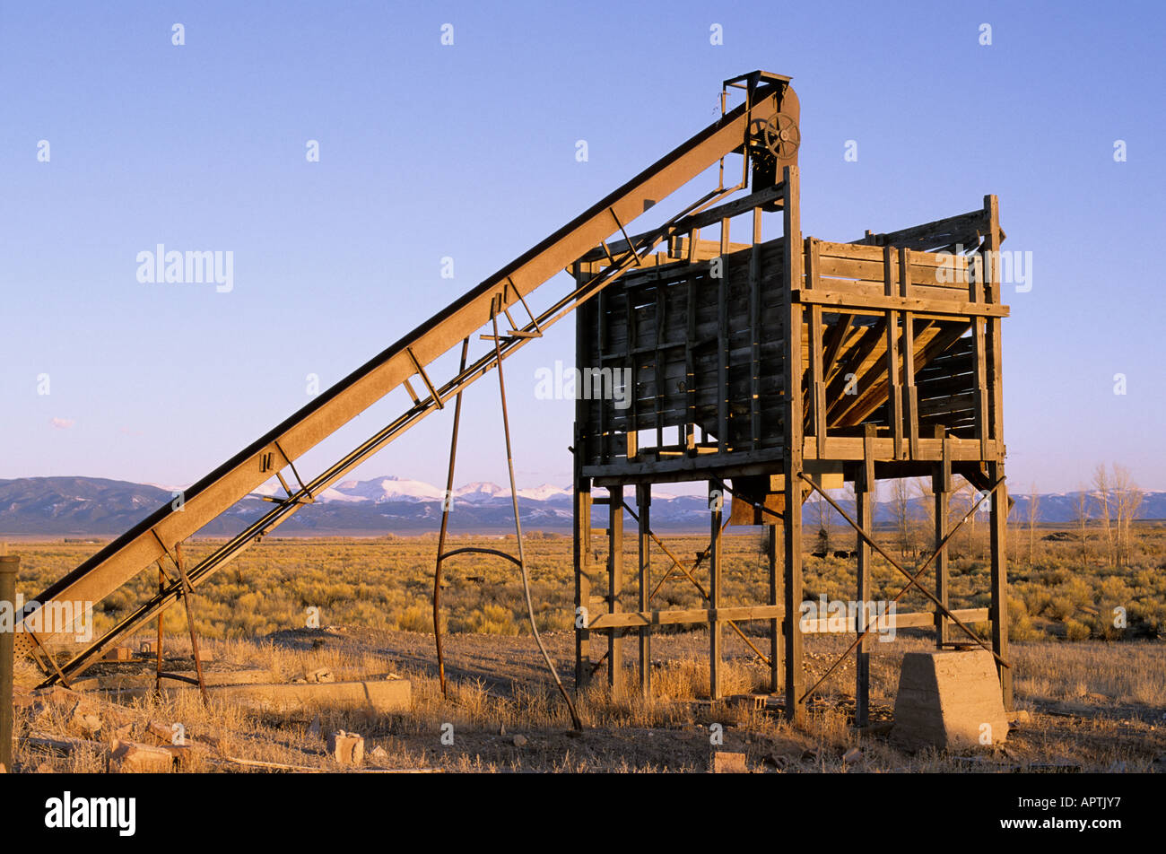 Abandoned loading equipment towers into the Colorado sky at an old rail ...