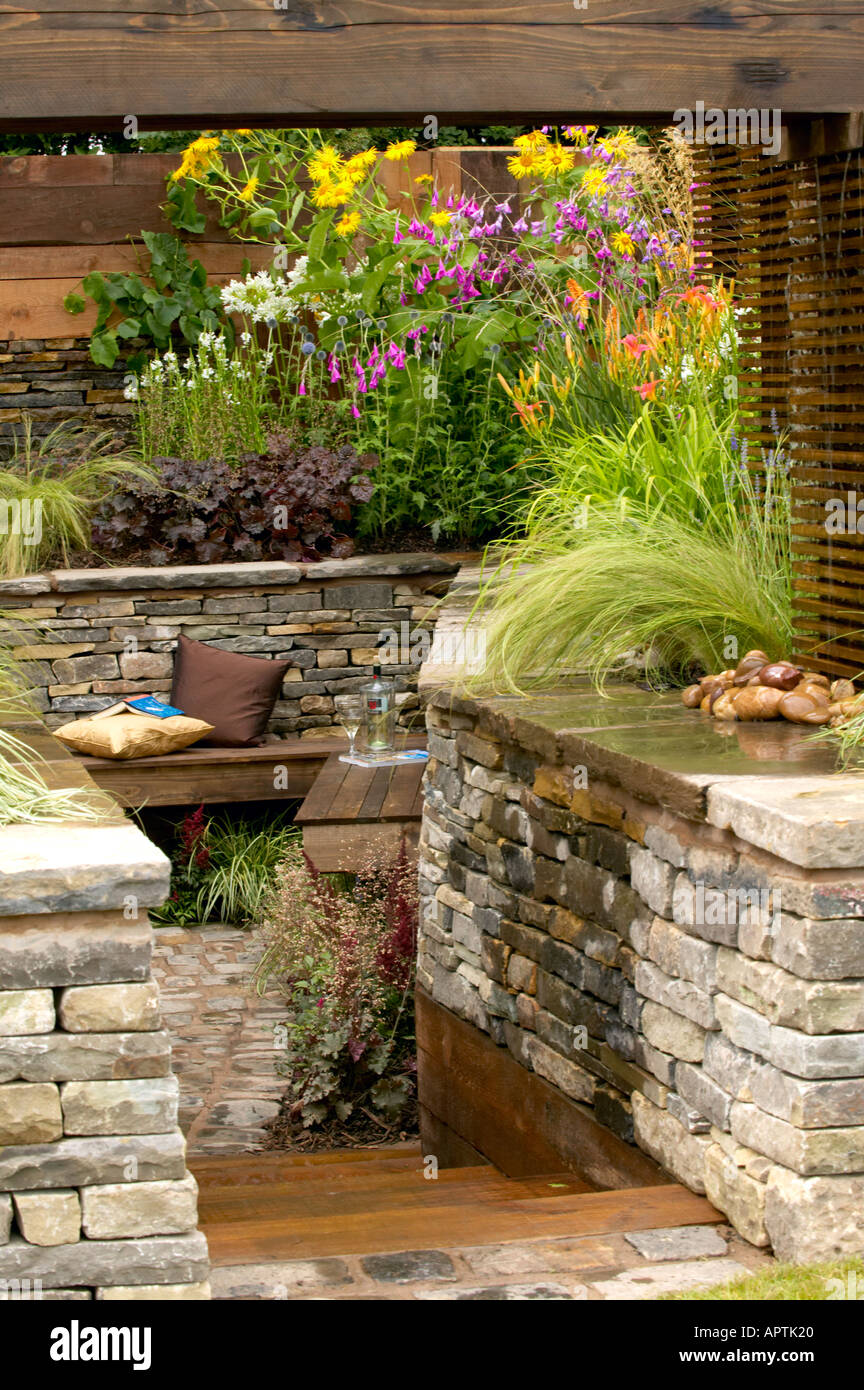 Tatton Flower Show well planted herbaceous bed with wooden pillars as ...
