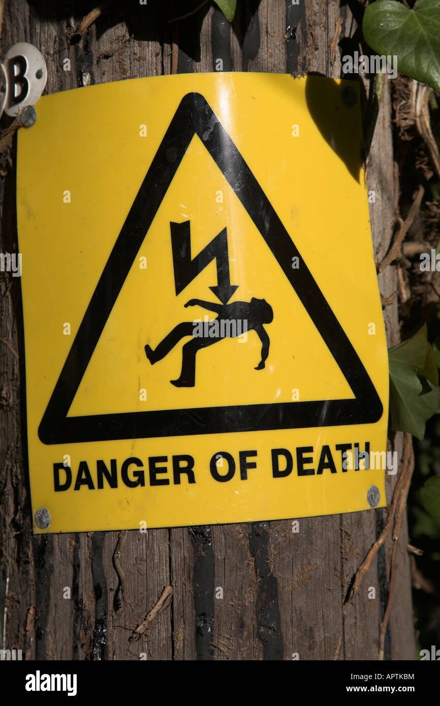 Danger of Death yellow electricity warning sign Stock Photo - Alamy