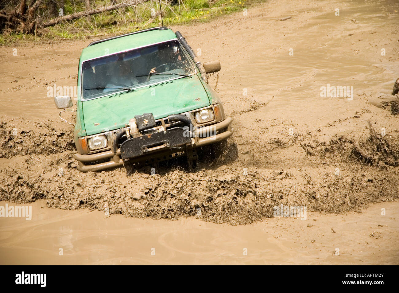 4x4 with a snorkel plowing through a mud hole Stock Photo - Alamy
