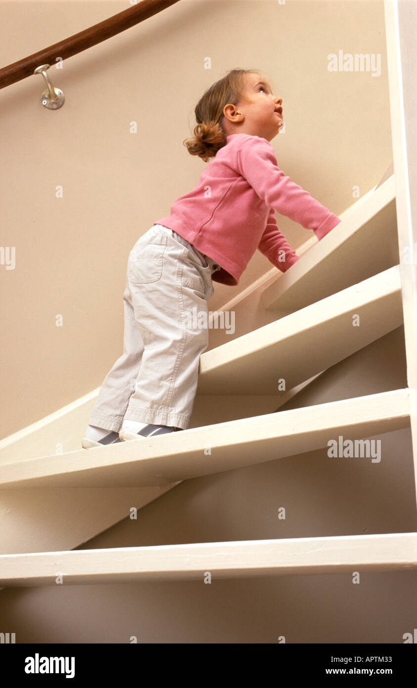 Little girl on a staircase Stock Photo - Alamy