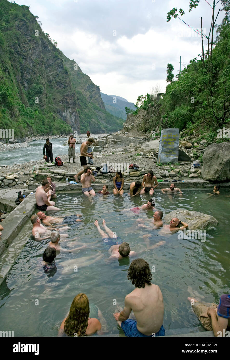 Trekkers relaxing at hot springs. Tatopani village. Annapurna circuit ...