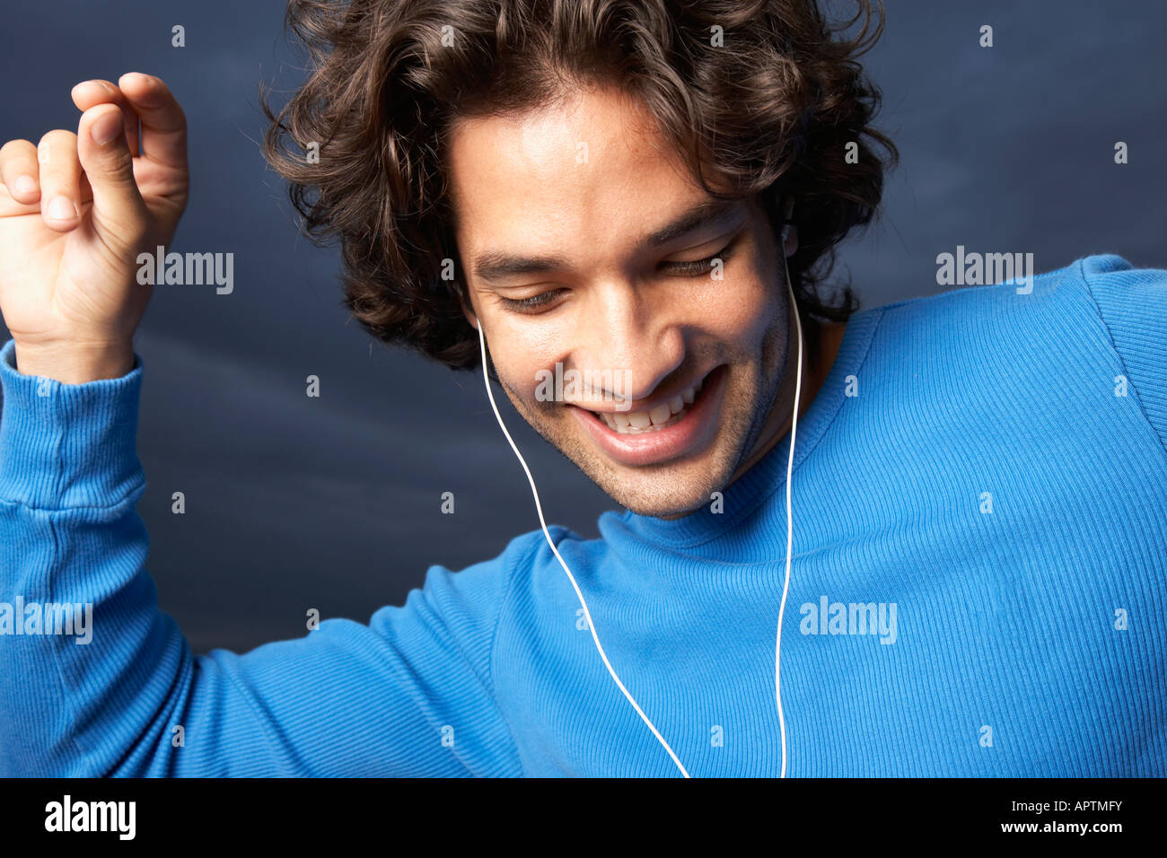 Hispanic man dancing to mp3 player Stock Photo - Alamy