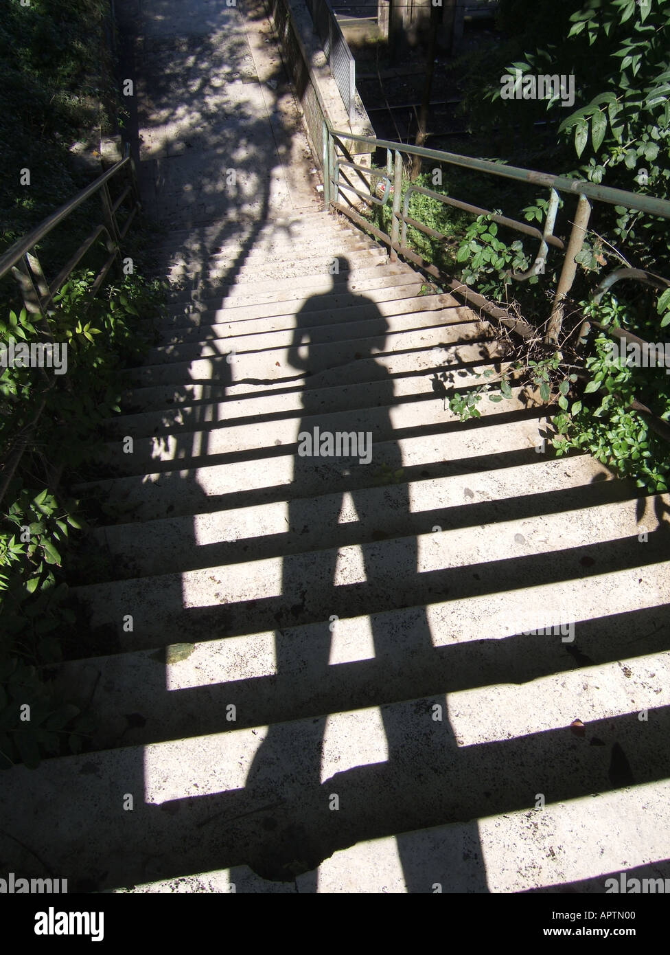 man's shadow on backlit steps Stock Photo - Alamy