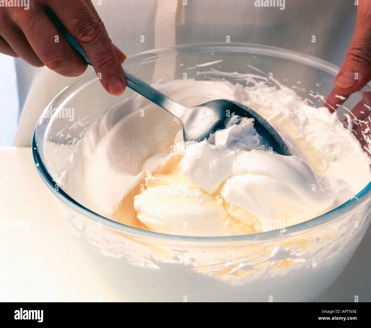 Steps to making meringue pavlova with large metal spoon cut and fold ...