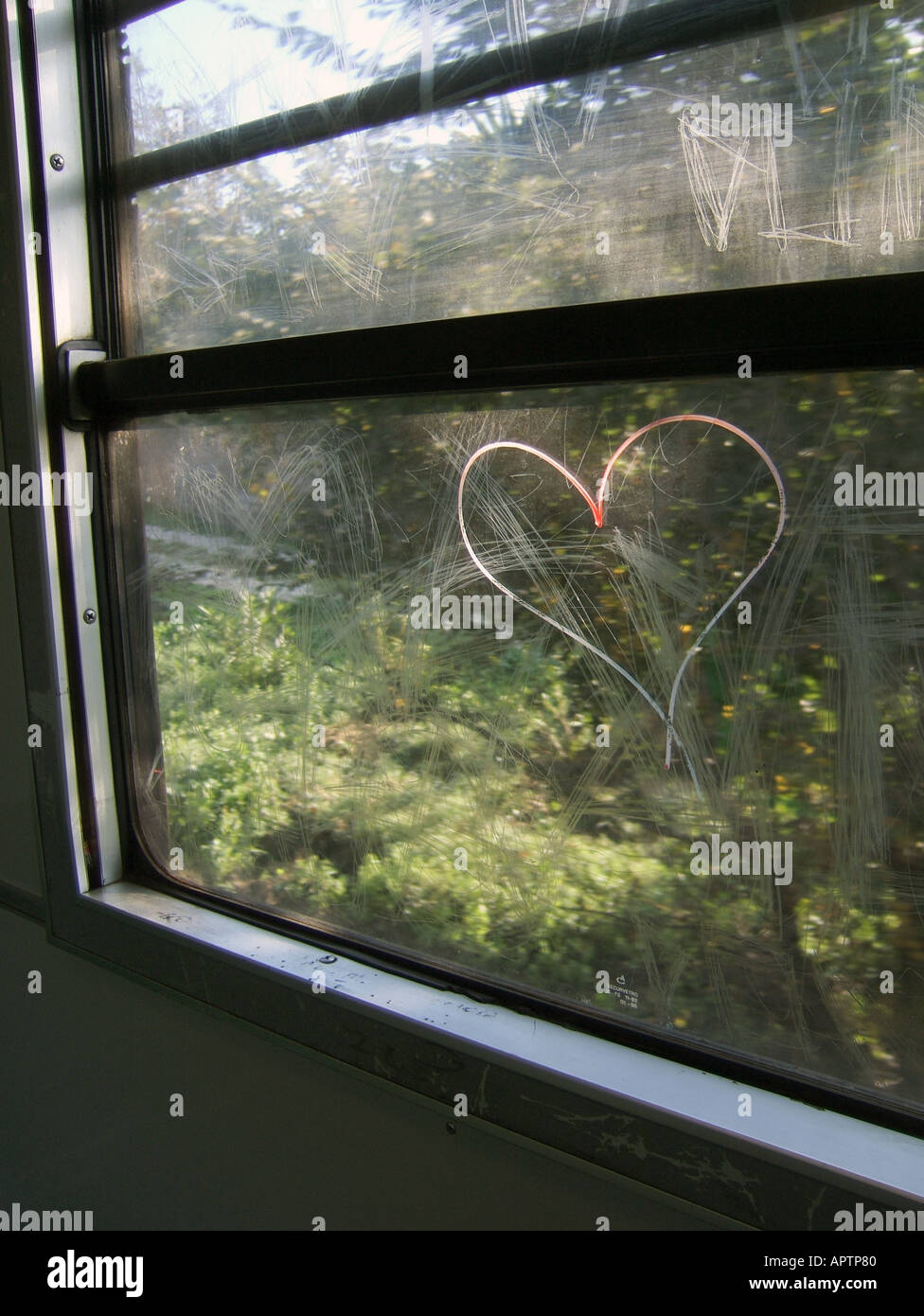 red heart drawn on train window Stock Photo - Alamy