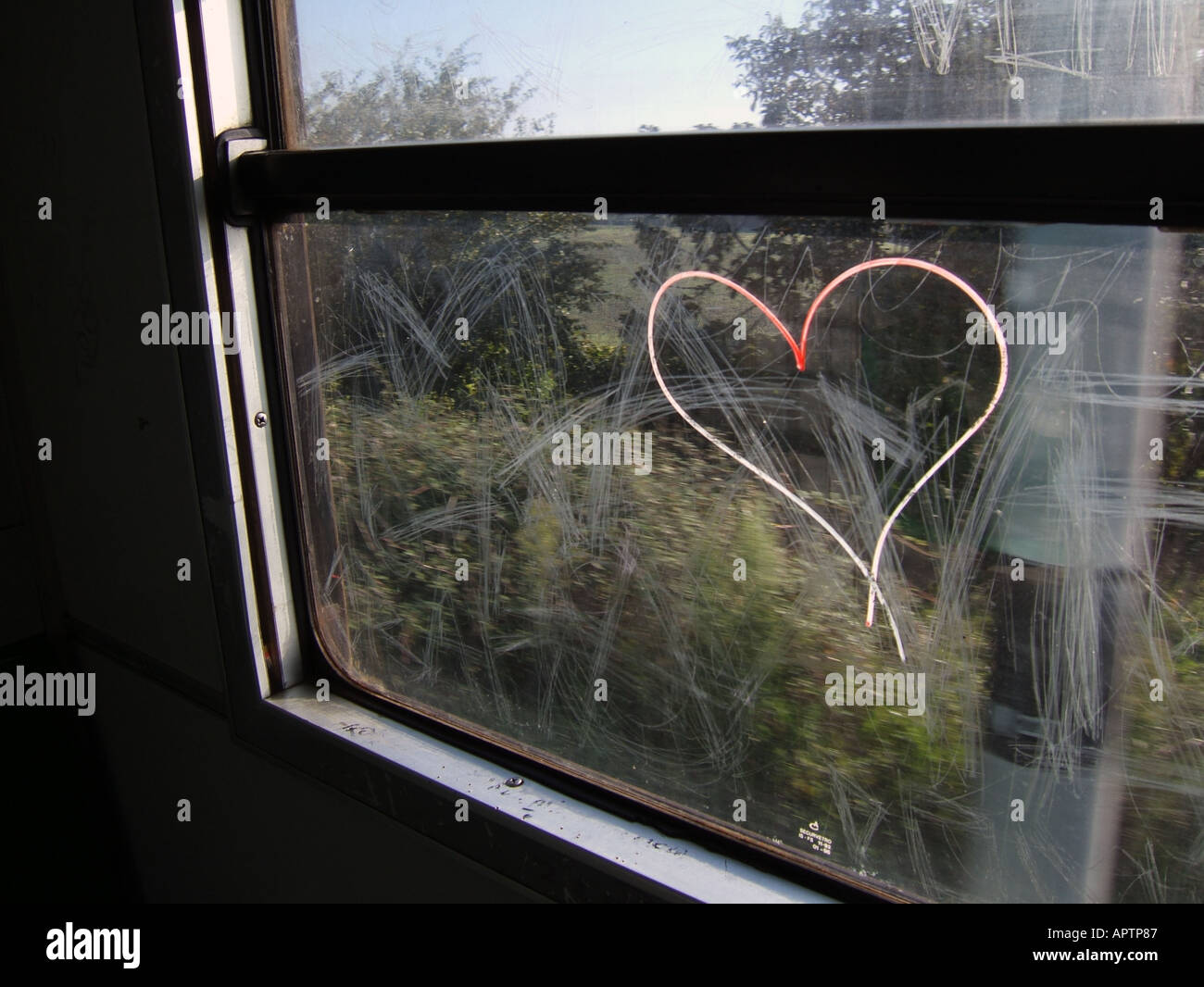 red heart drawn on train window Stock Photo - Alamy