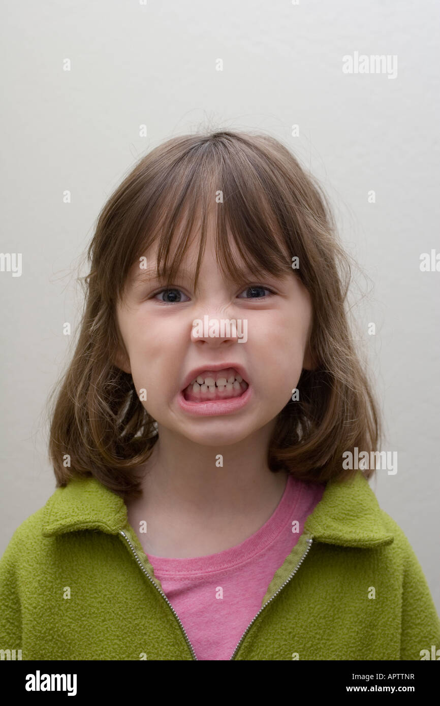 Four year old girl with growling expression Stock Photo - Alamy