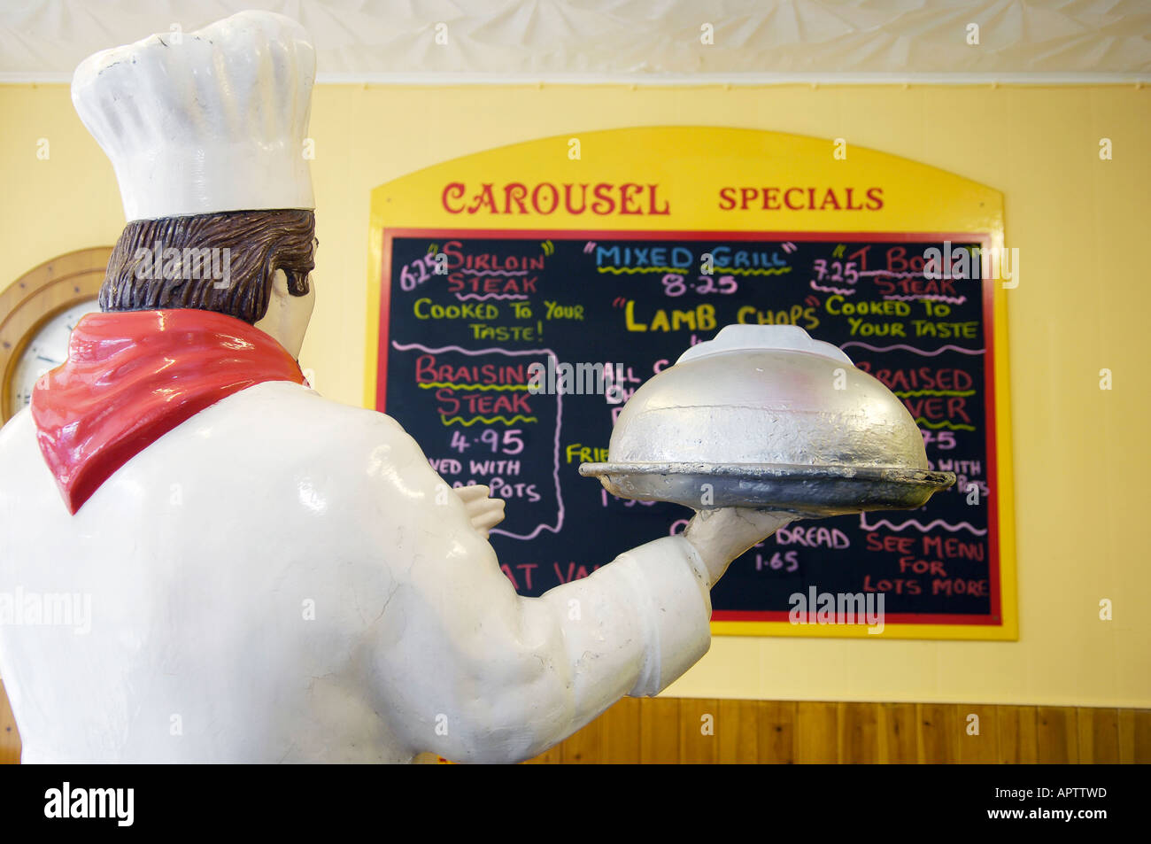Model chef in front of chalk board menu on restaurant wall Stock Photo ...