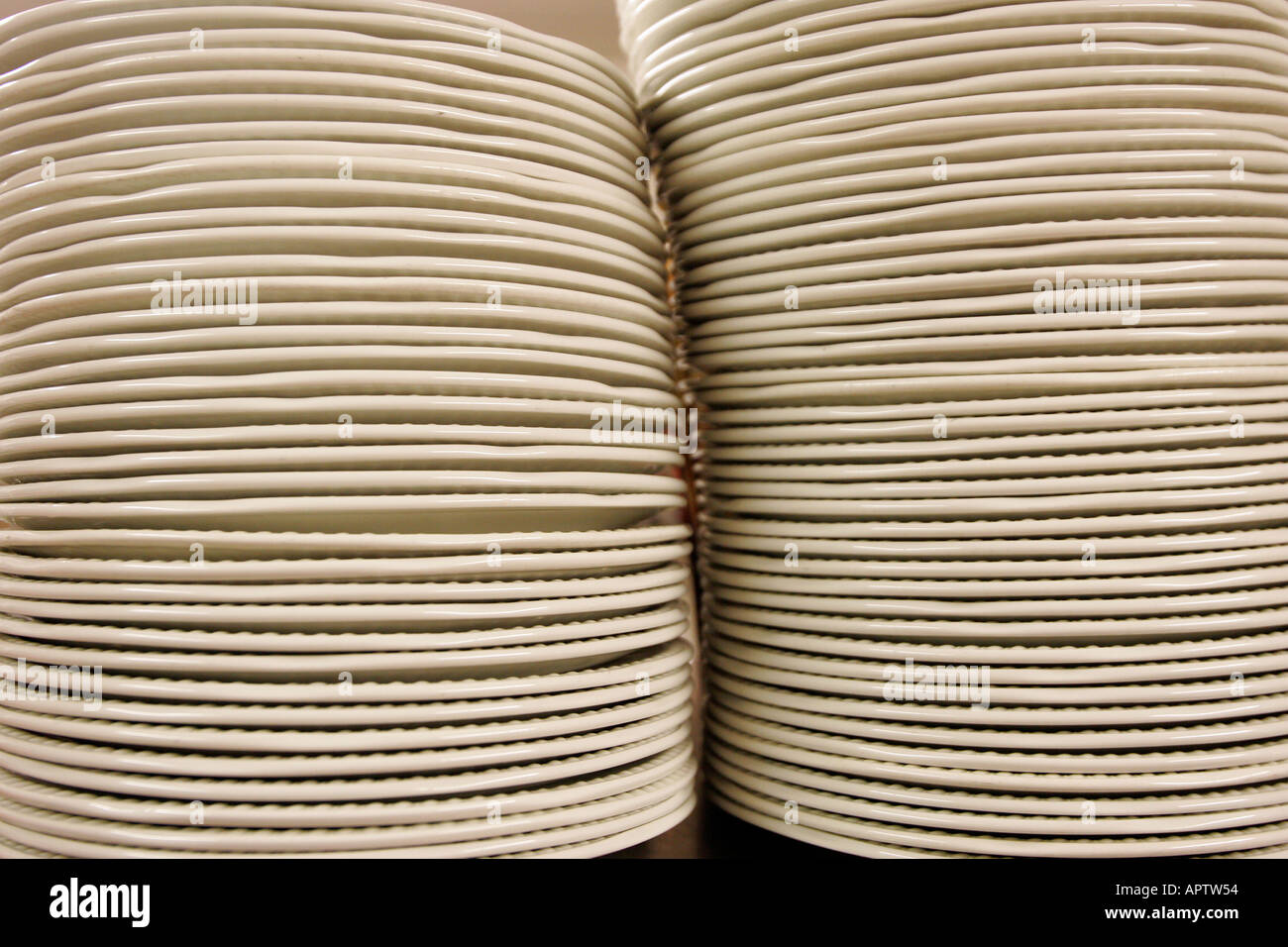 A stack of plates in a kitchen Stock Photo - Alamy