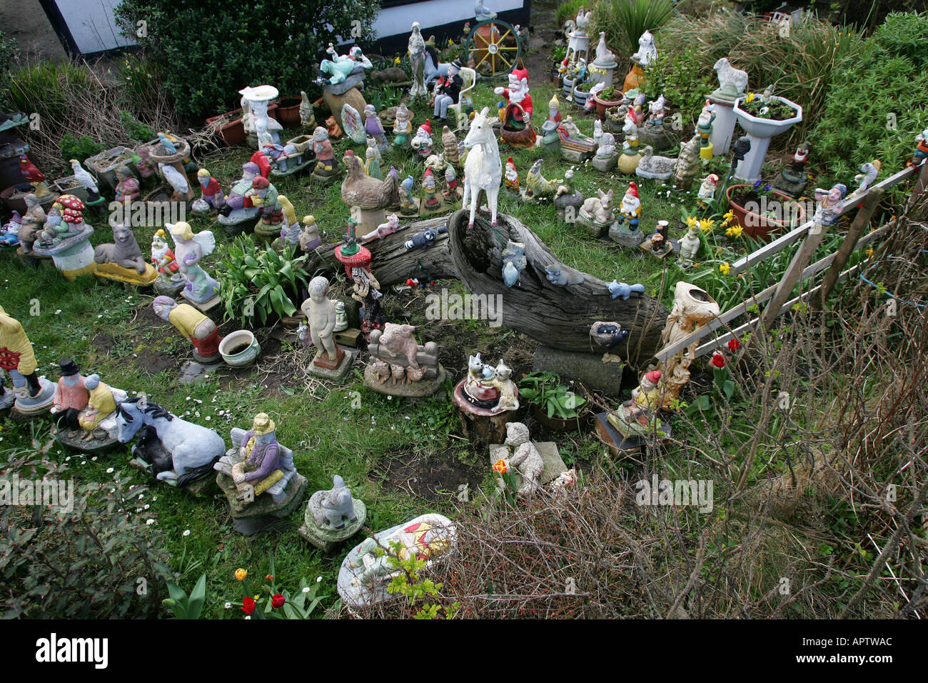 Collection of gnomes and other garden ornaments in a garden Stock Photo ...