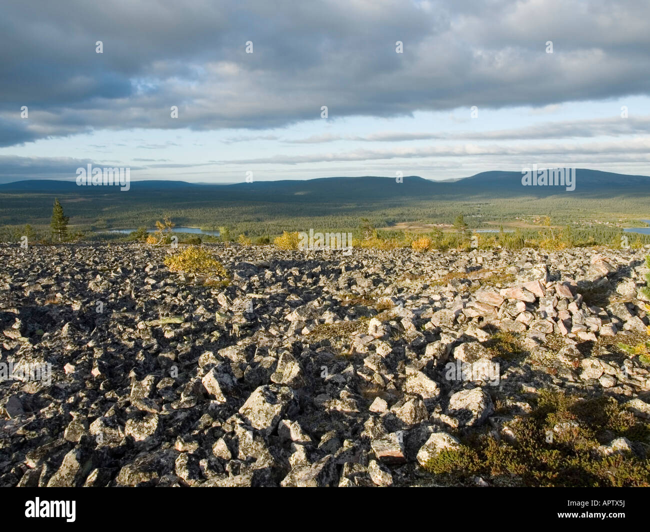 overview over landscape with fells and lakes from stone covered fell in ...