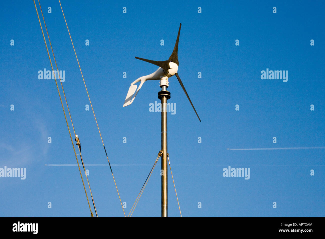 Marine wind turbines, with aircraft and vapour trails visible in the ...