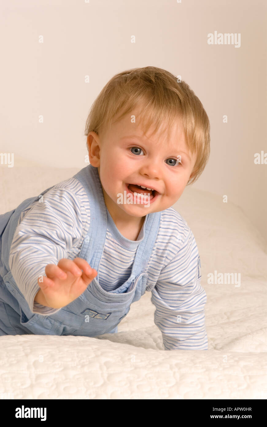 One year old baby boy looking at camera laughing smiling happy mouth ...