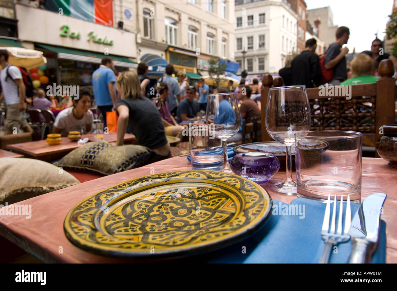 People eating and drinking in restaurants on Old Compton Street, West ...