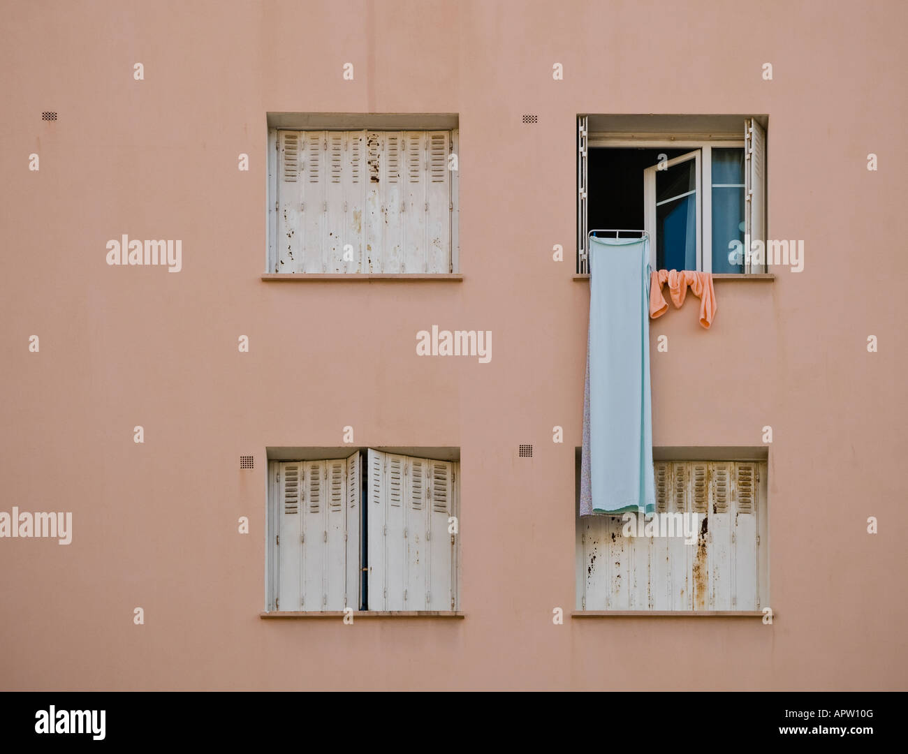 Laundry drying outside windows little resort town Stock Photo - Alamy