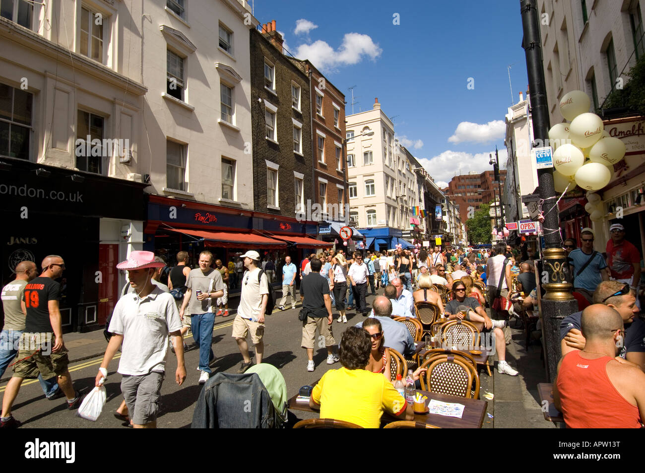 People eating and drinking in restaurants on Old Compton Street, West ...