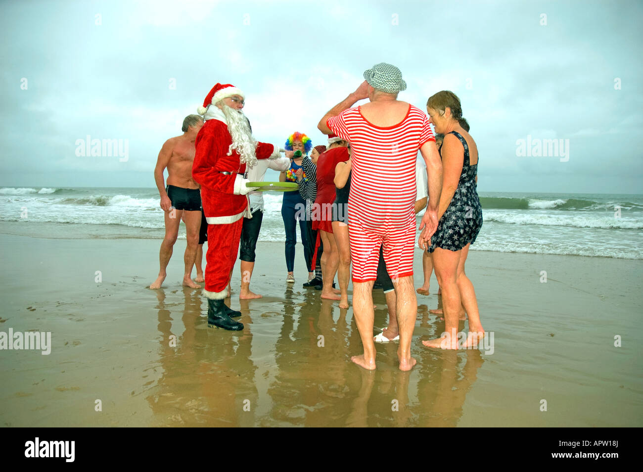 Santa giving out drinks at the Christmas day swim on Bournemouth beach ...