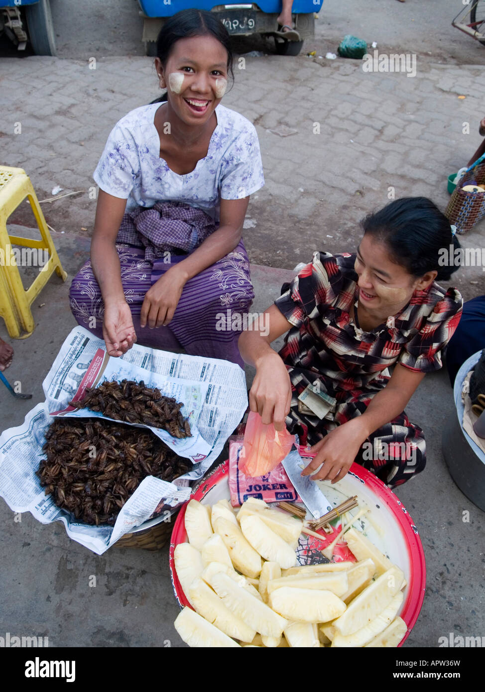 smiling Burmese girls selling bugs in the market at Mandalay Stock ...