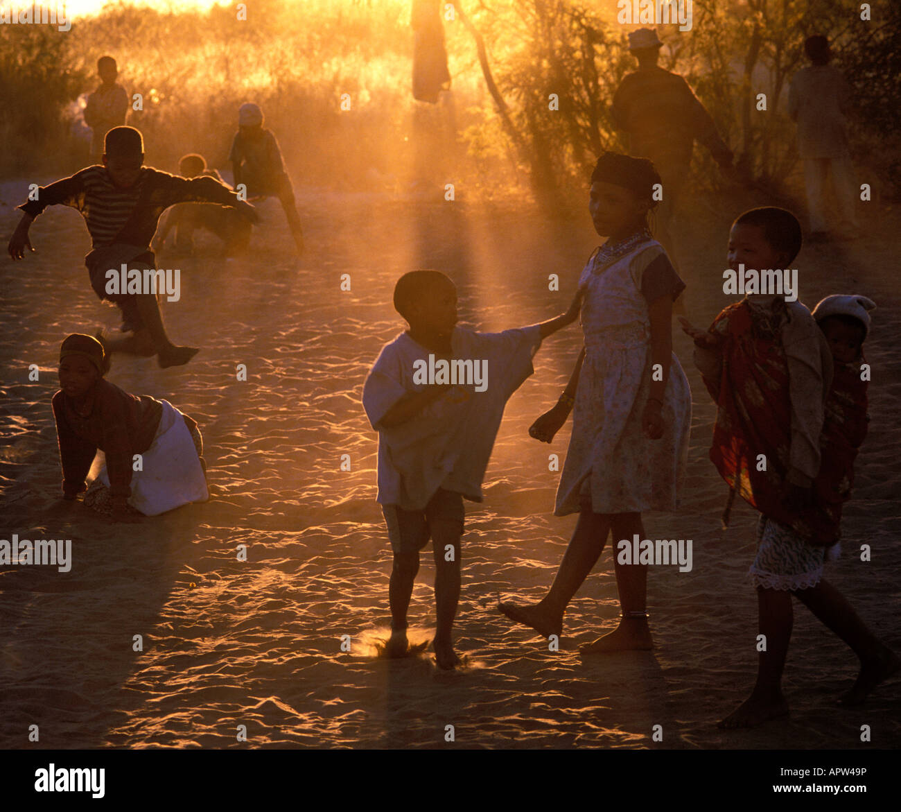 Bushman children playing in the sand Den ui village Bushmanland Namibia ...