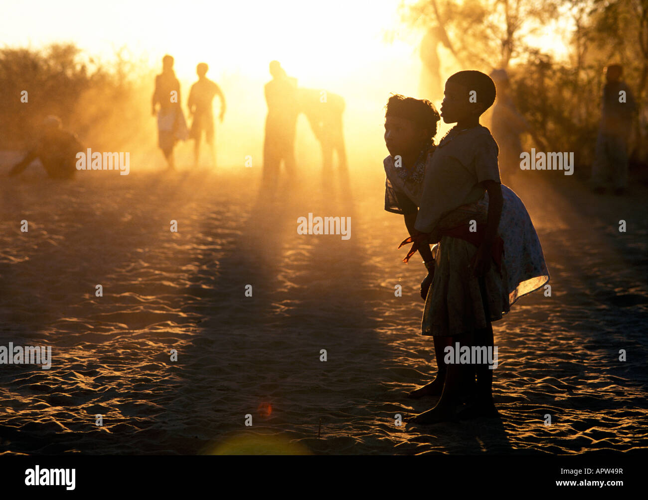 Bushman children playing in the sand Den ui village Bushmanland Namibia ...