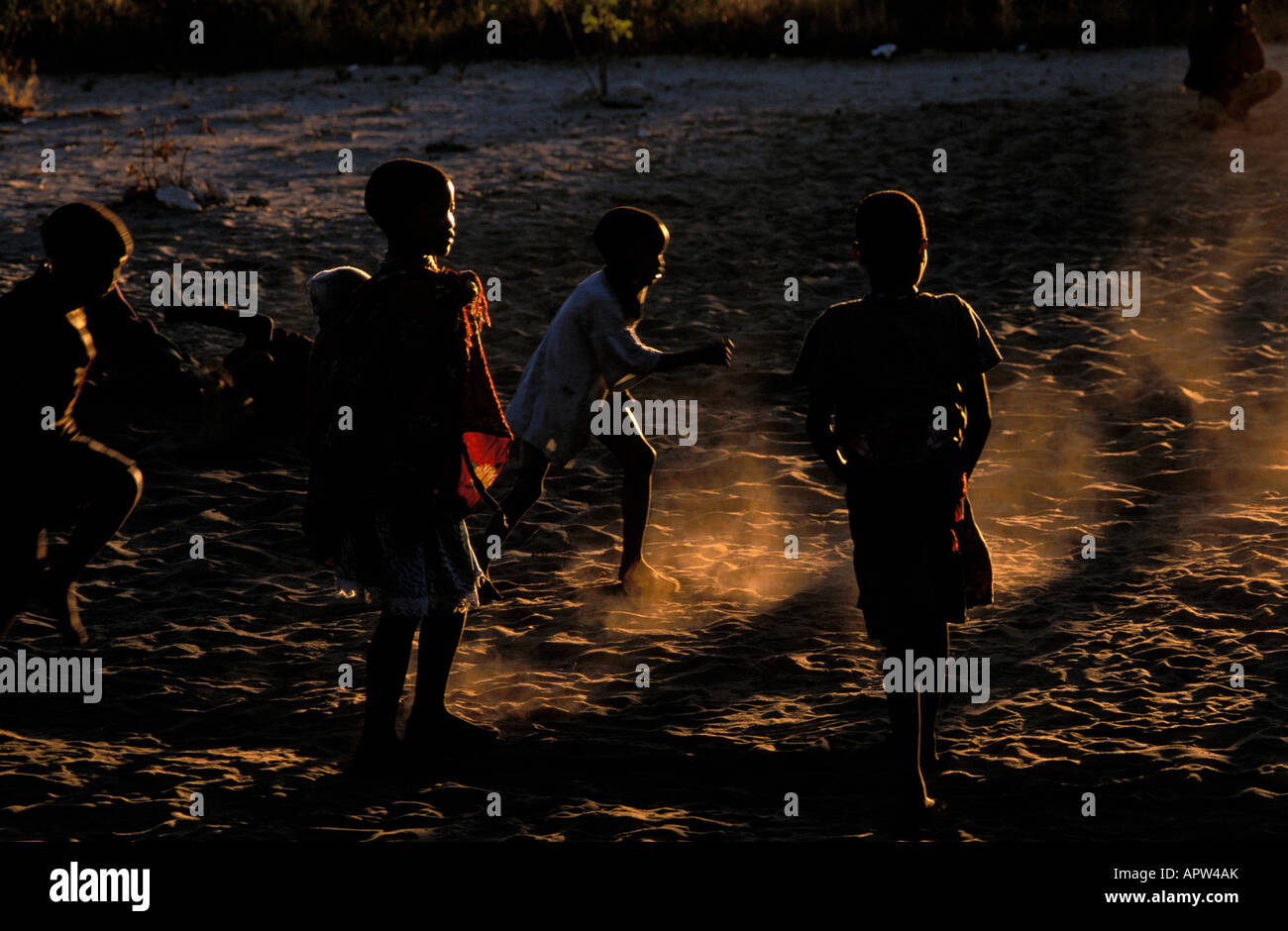 Bushman children playing in the sand Den ui village Bushmanland Namibia ...