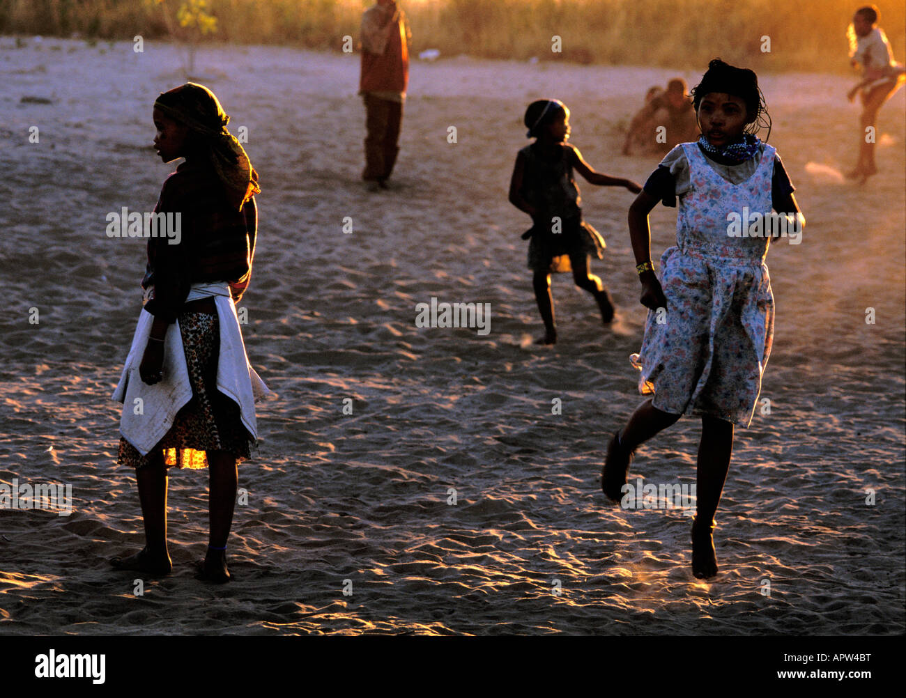 Bushman children playing in the sand Den ui village Bushmanland Namibia ...