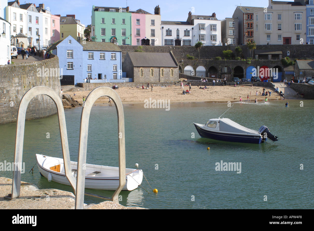 Tenby Wales colourful pastel buildings on the sea front beach harbour ...