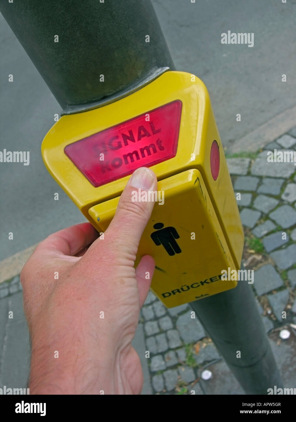 hand on button of pedestrian light giving command for signal Stock ...