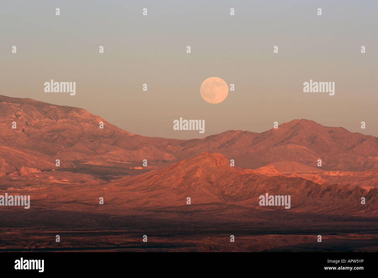 The moon over red rock Stock Photo - Alamy