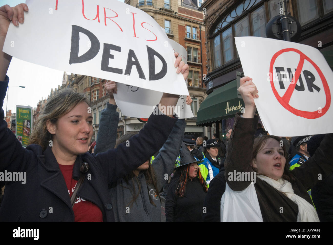 Women hold up posters 'Fur is Dead' as National Anti-Fur march reaches ...