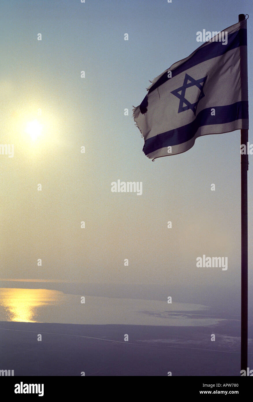 The Israeli national flag at Masada with the sun rising over the Dead ...