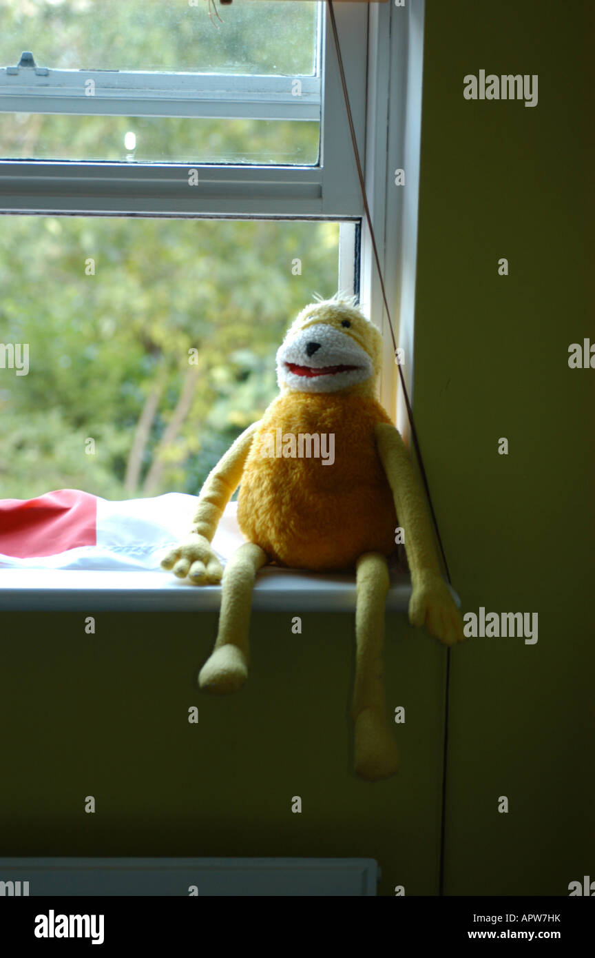 puppet, stuffed child's toy on window ledge Stock Photo - Alamy