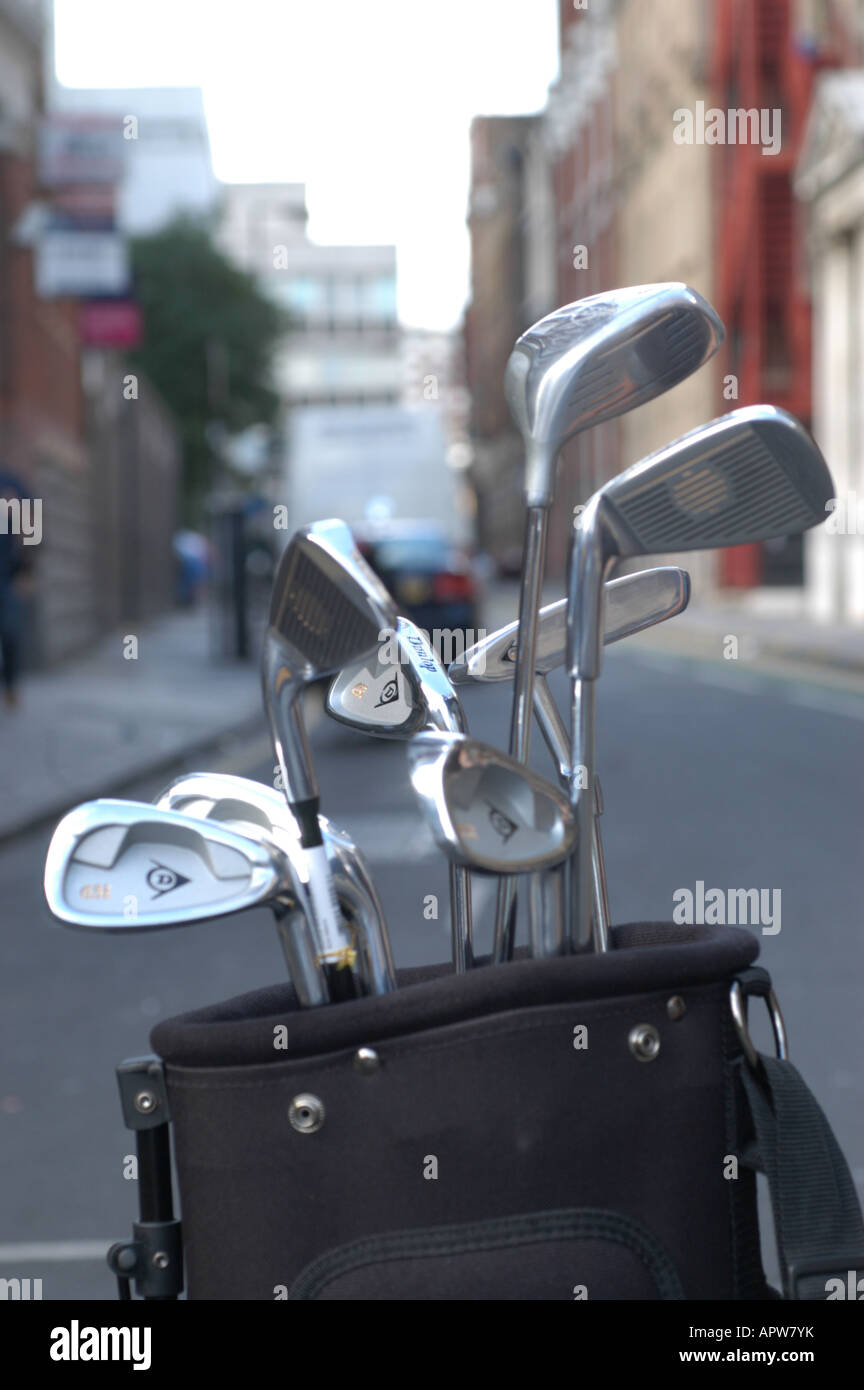 golf clubs & caddy on street Stock Photo - Alamy