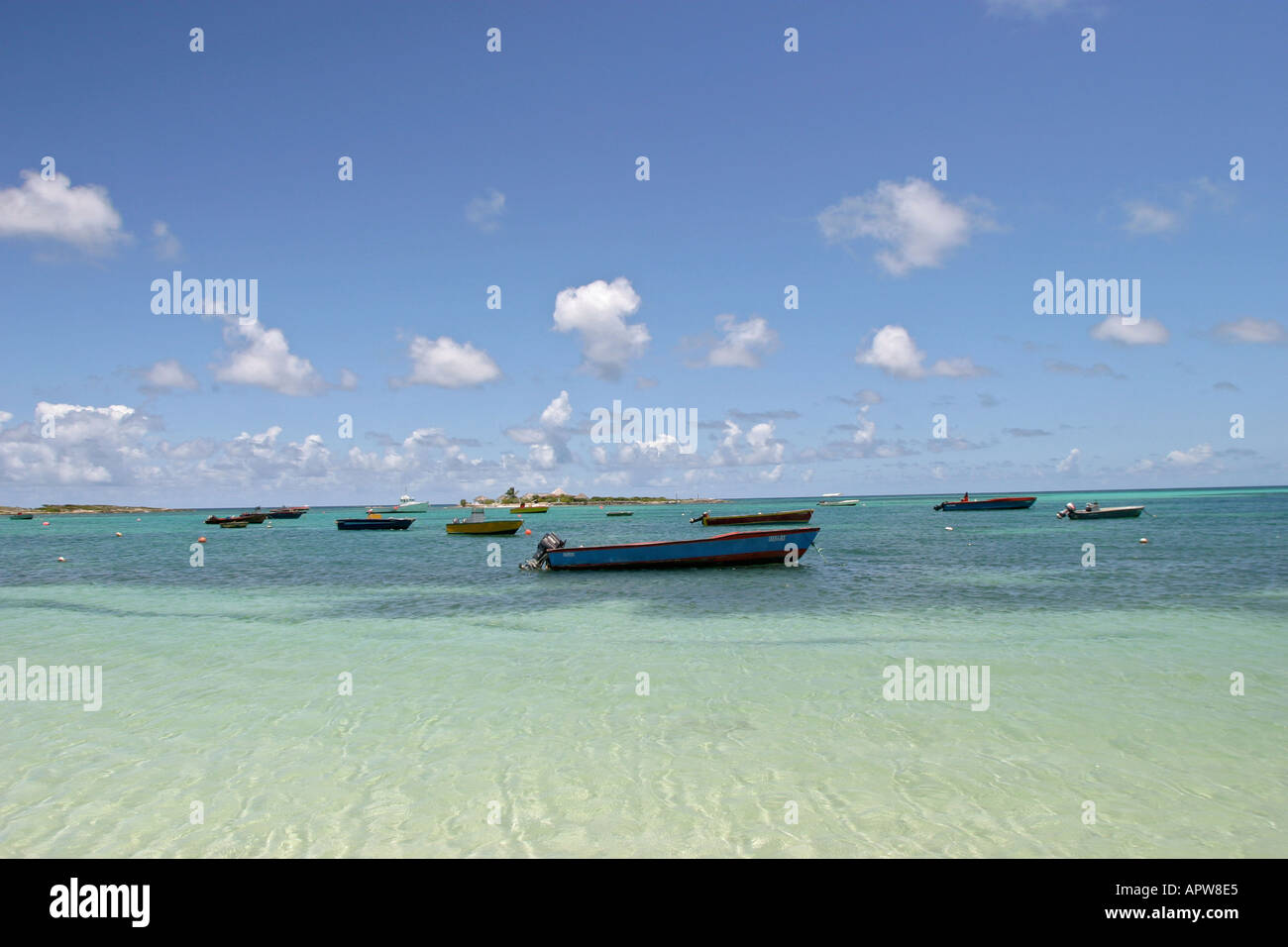 Fishing boats floating off the beach in Island Harbour off the island ...